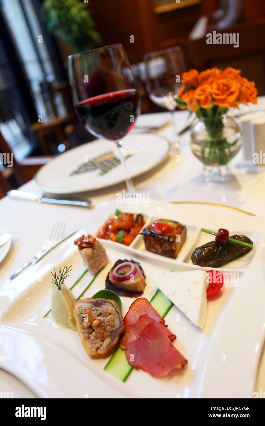 Traditional Turkish appetizer foods (Turkish meze) with red wine on the ...