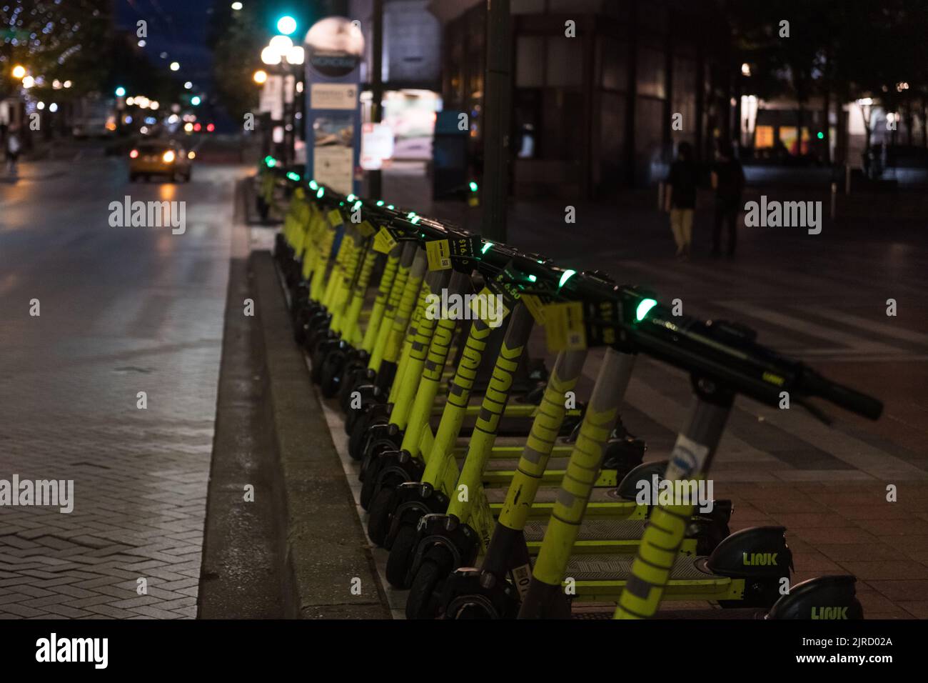Seattle, USA. 21 Aug, 2022. Dozens of Link EV Scooter lined up downtown ...