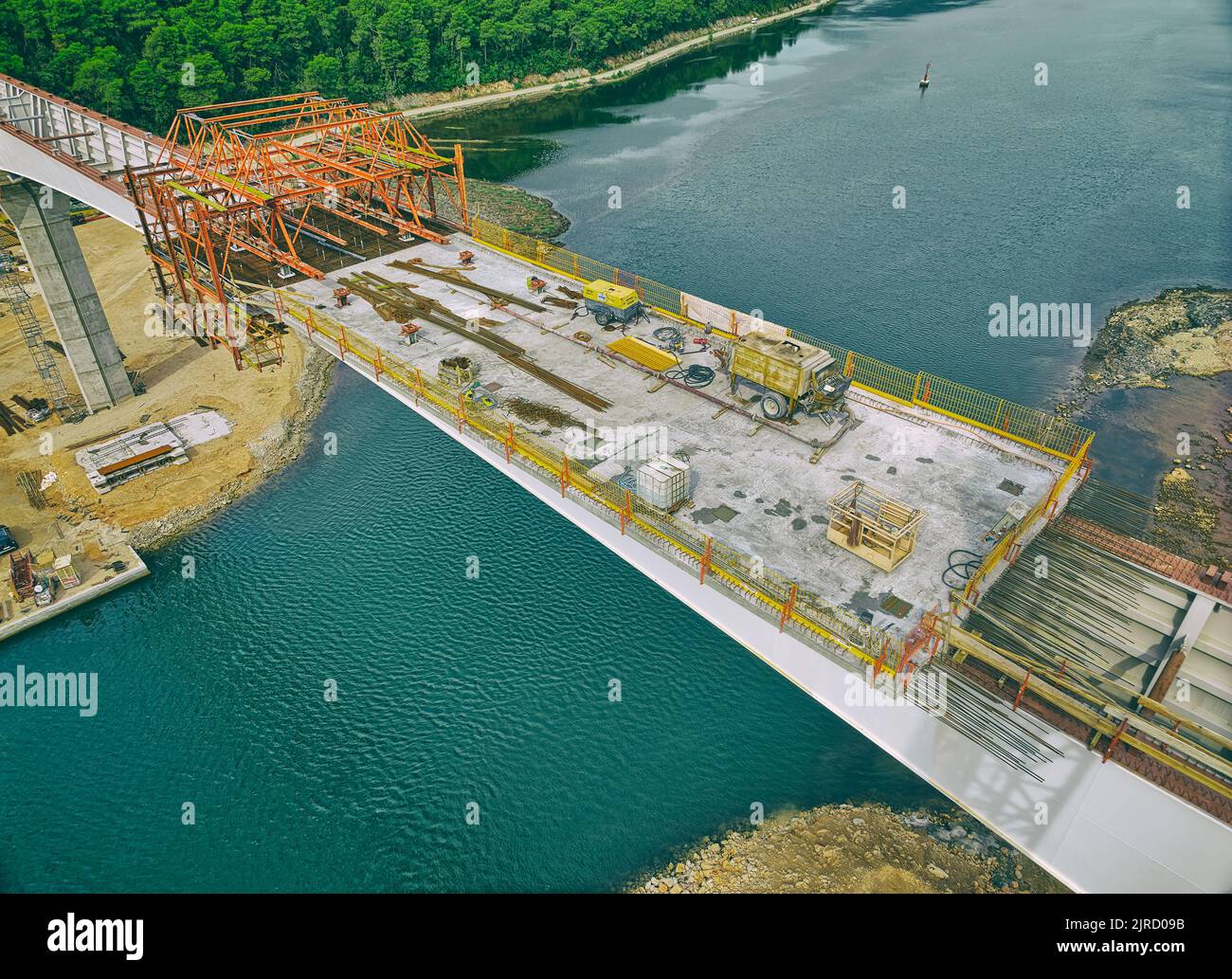 Construction site of the bridge over the sea bay Stock Photo - Alamy