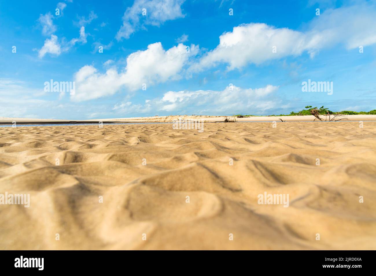 View of the beach sand against the sea and the beautiful blue sky with ...