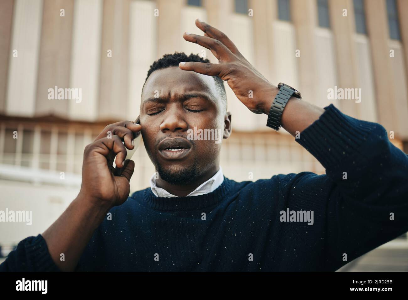 Tired, angry and stress business man talking on an annoying phone call ...