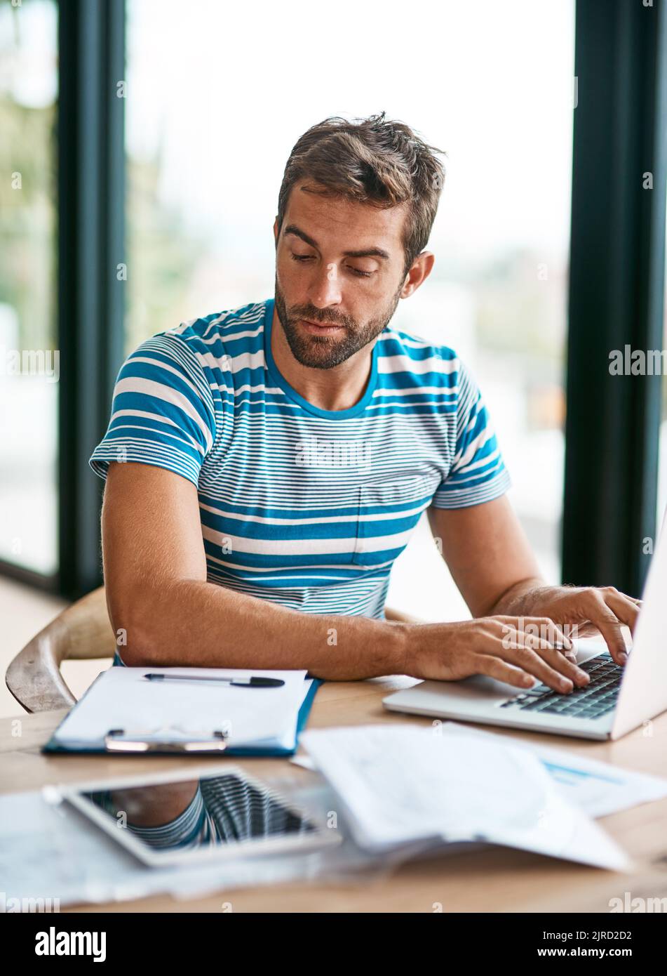 Putting the figures onto a spreadsheet. a handsome young male ...