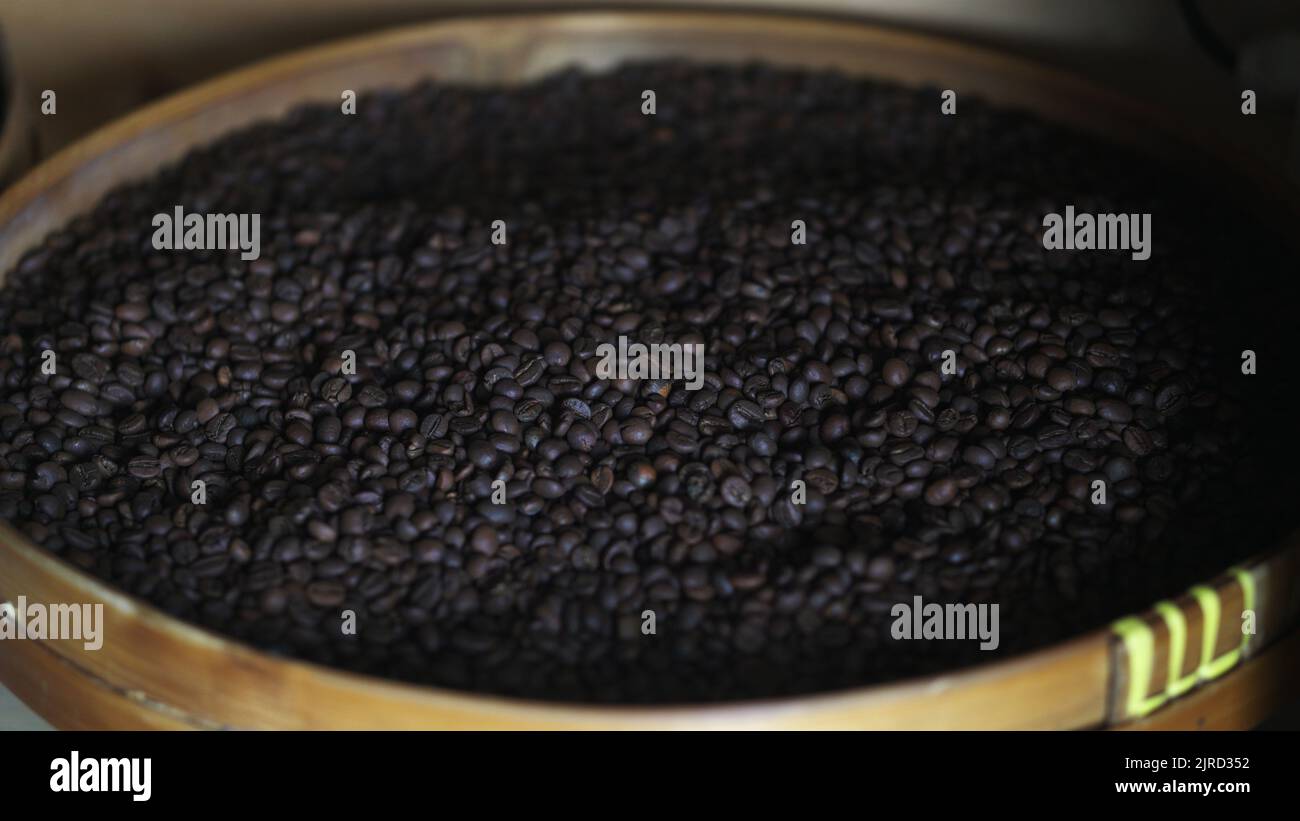 A large heap of coffee beans inside a wooden barrel Stock Photo - Alamy