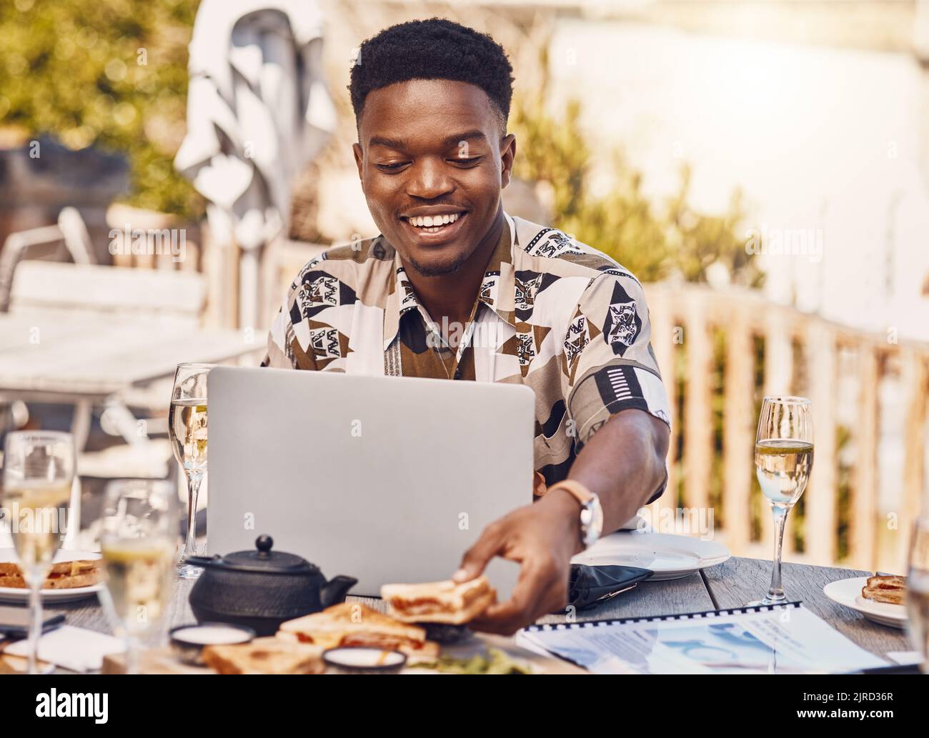 Man eating and working with laptop hi-res stock photography and images ...