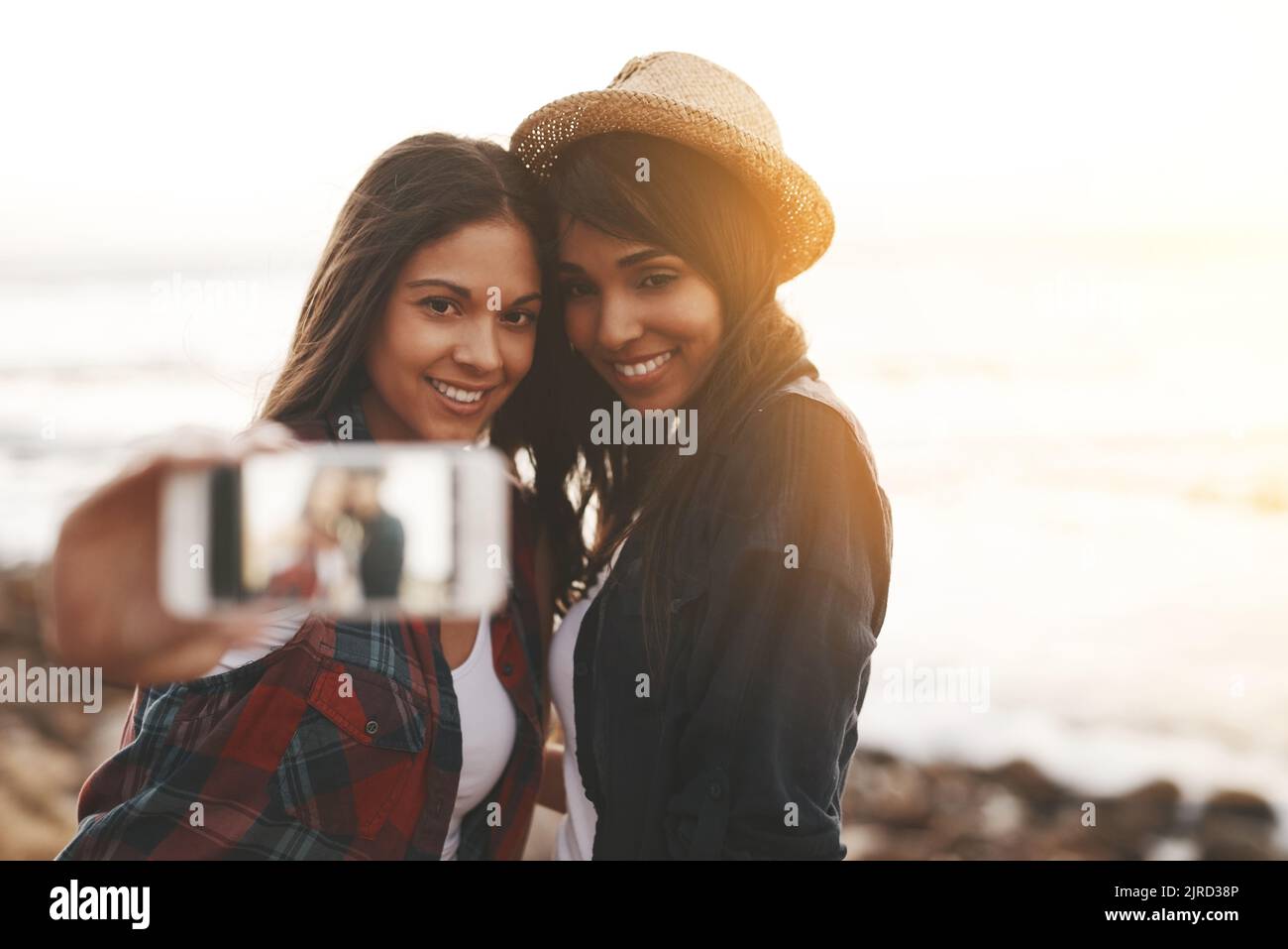Snapshots of summer memories. two young friends taking a selfie ...