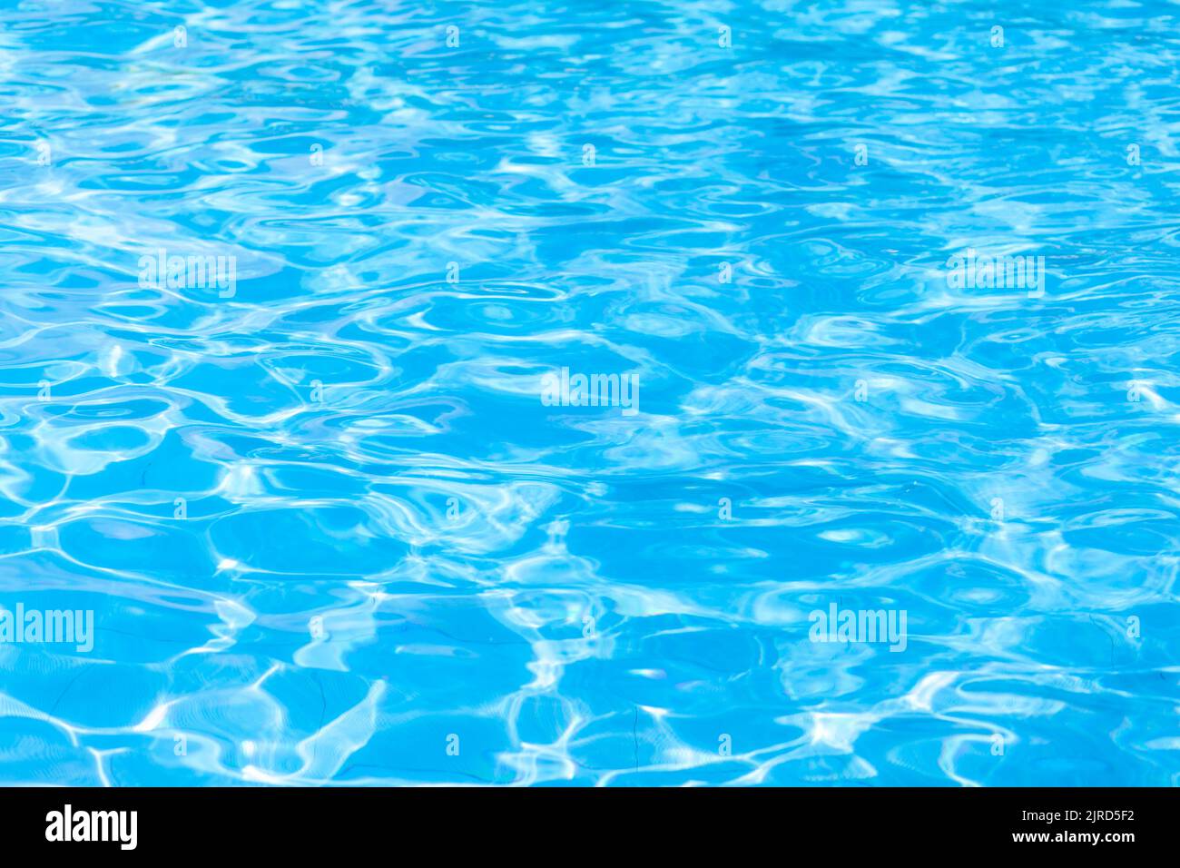 Water background, ripple and flow with waves. Summer blue swiming pool ...