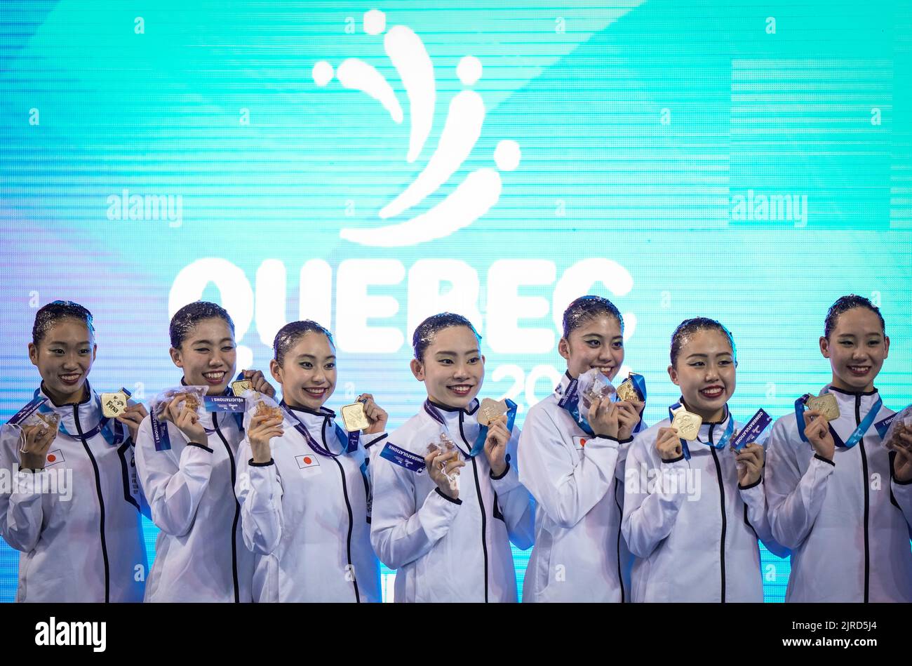 Team Japan poses with their medals after the team technical program at the World Junior Artistic ...