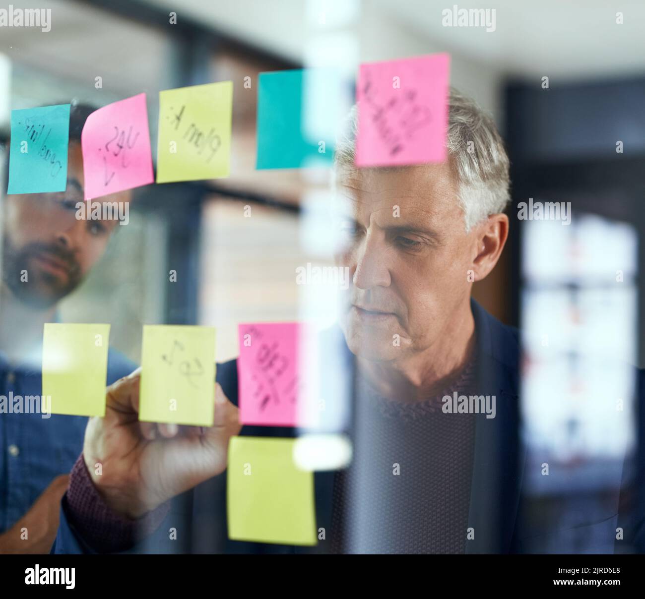 Every idea matters. two colleagues having a brainstorming session in a ...