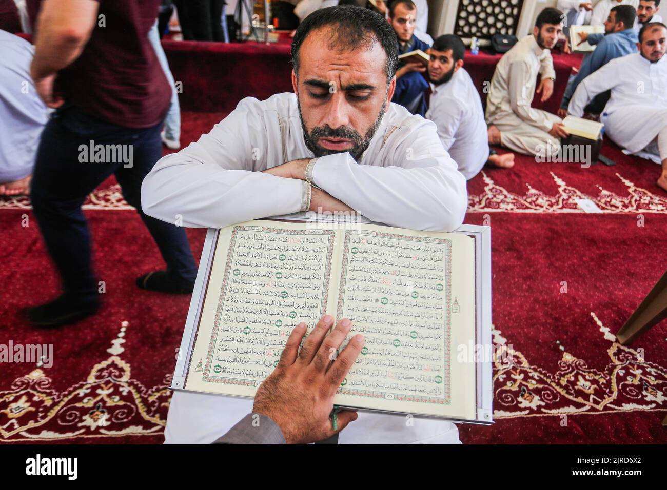 Gaza City, Palestine. 23rd Aug, 2022. A Palestinian Muslim man reads ...