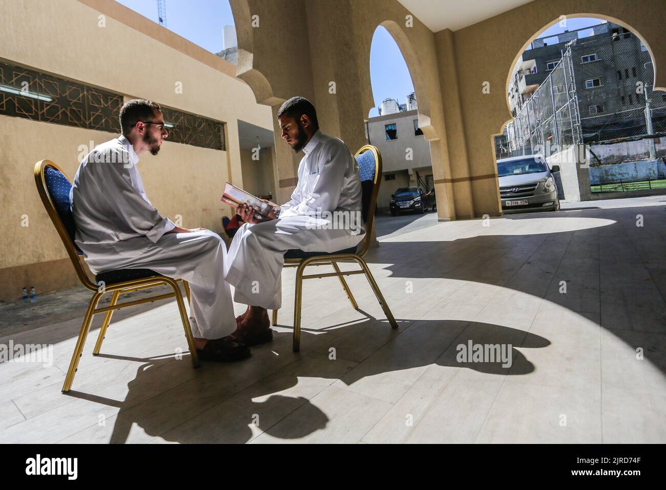 Palestinian Muslims read the Holy Quran during one session, an ...