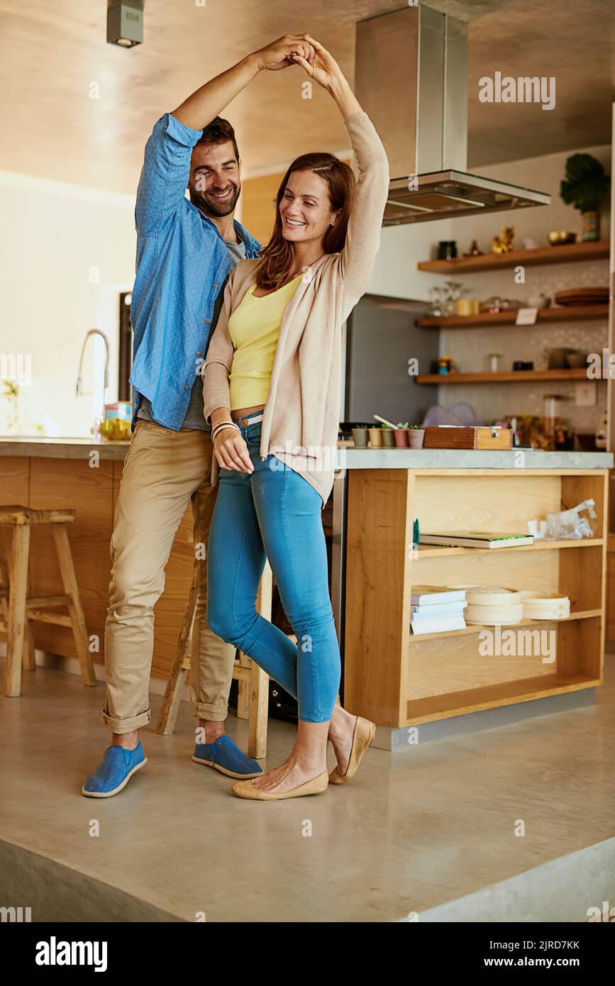 Lovely couple dancing joyfully together hi-res stock photography and ...
