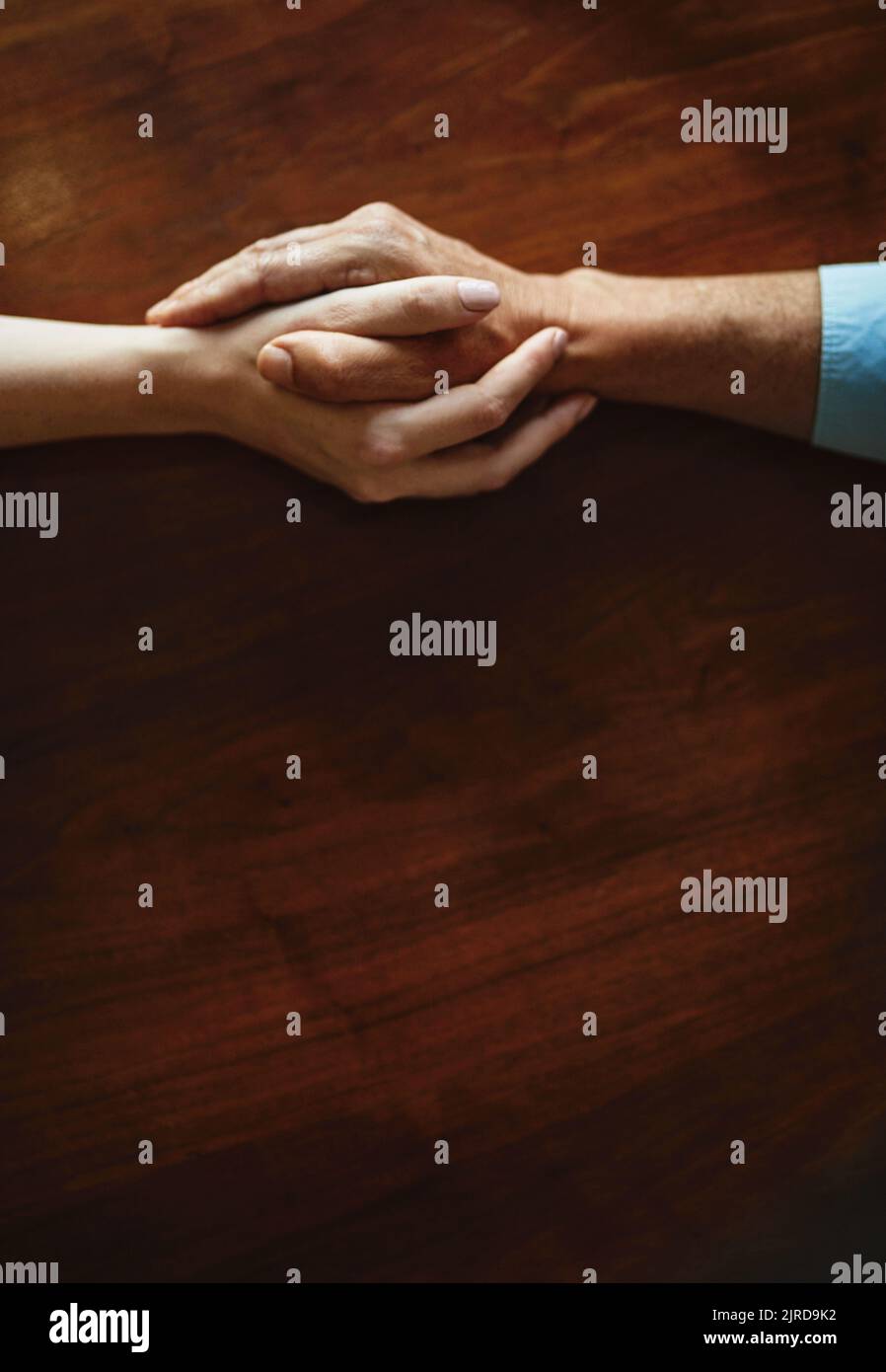 Offering comfort and support in a time of need. Closeup shot of two ...