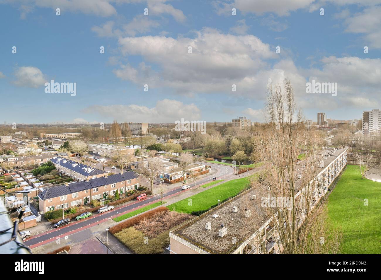 Front view of old brick buildings and cars with bicycles from small ...
