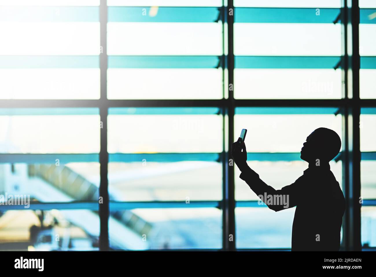 Theres so much to see at the airport. an unidentifiable traveler using ... Theres so much to see at the airport. an unidentifiable traveler using ...