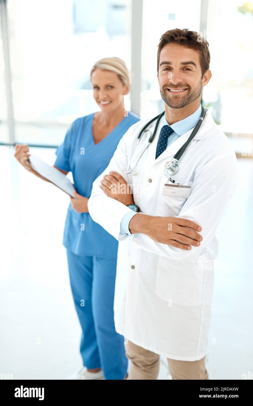 We save lives, together. Cropped portrait of two happy healthcare ...