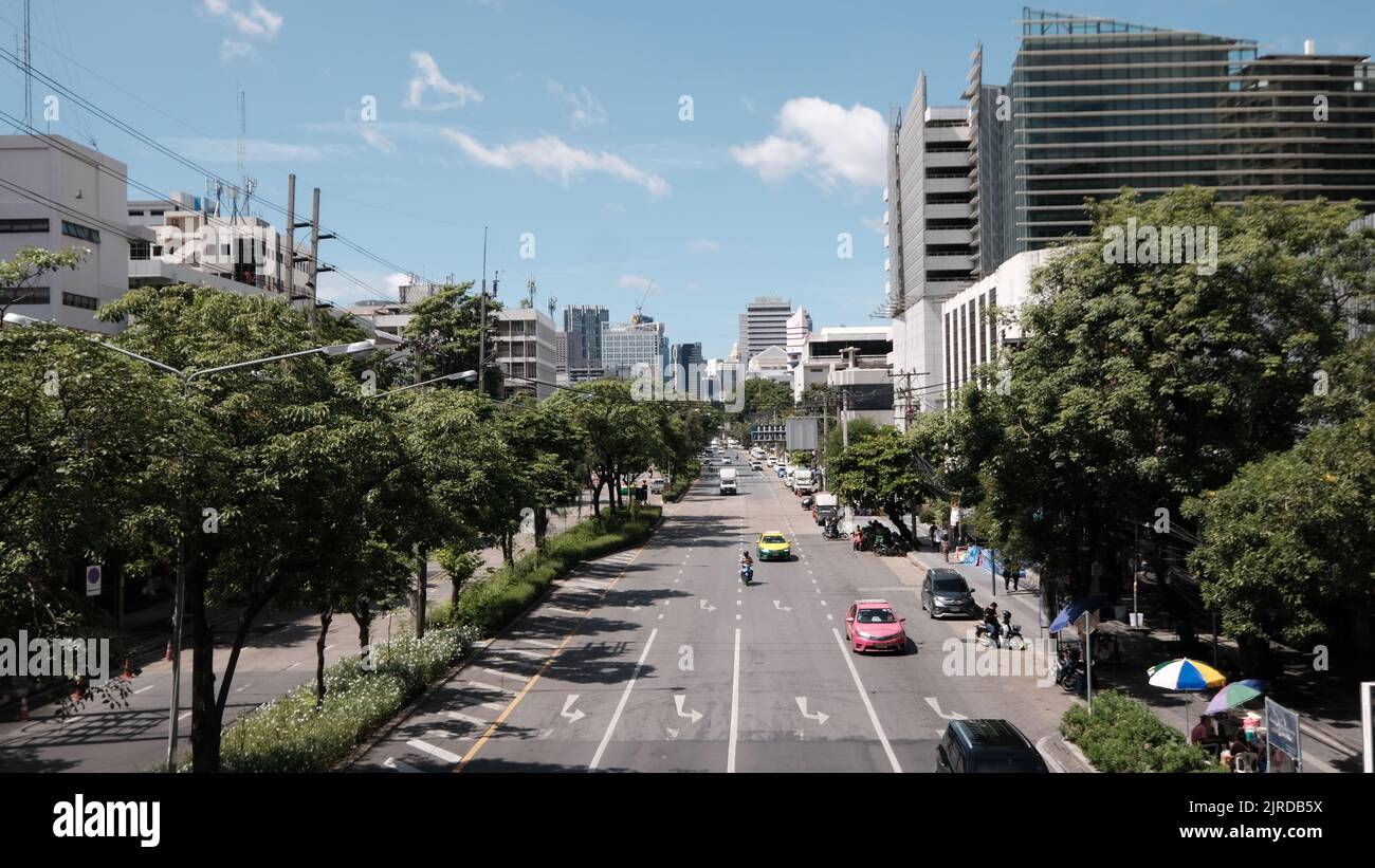 Tree lined Street in urban Bangkok Thailand Stock Photo - Alamy