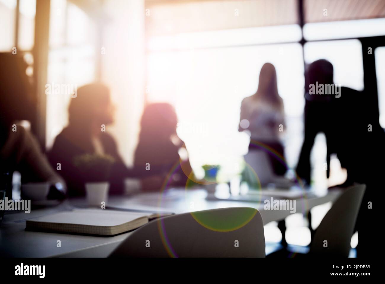 Bringing business into focus. two business colleagues talking together ...