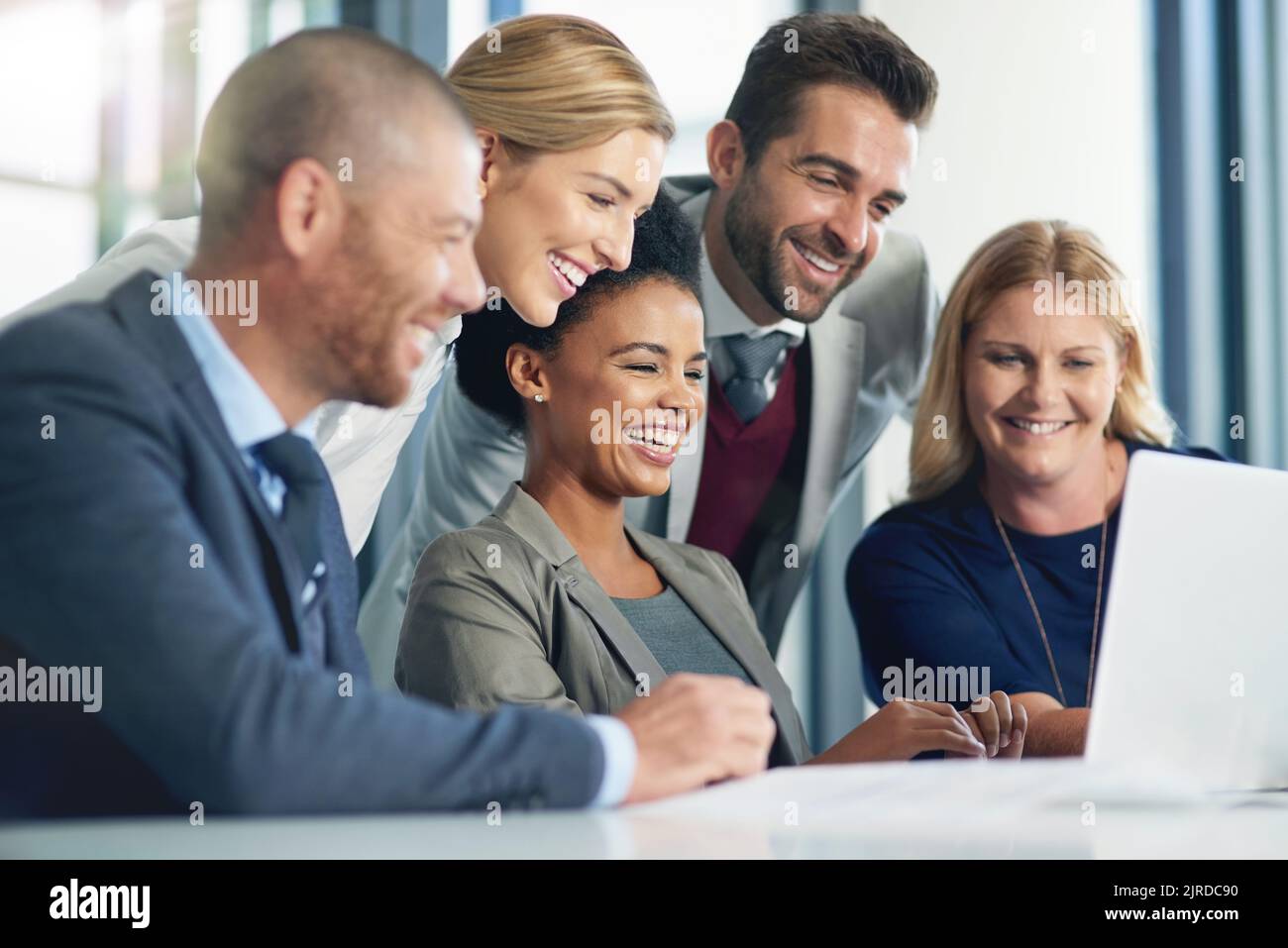 Working hard as a goal-oriented team. a group of businesspeople working ...