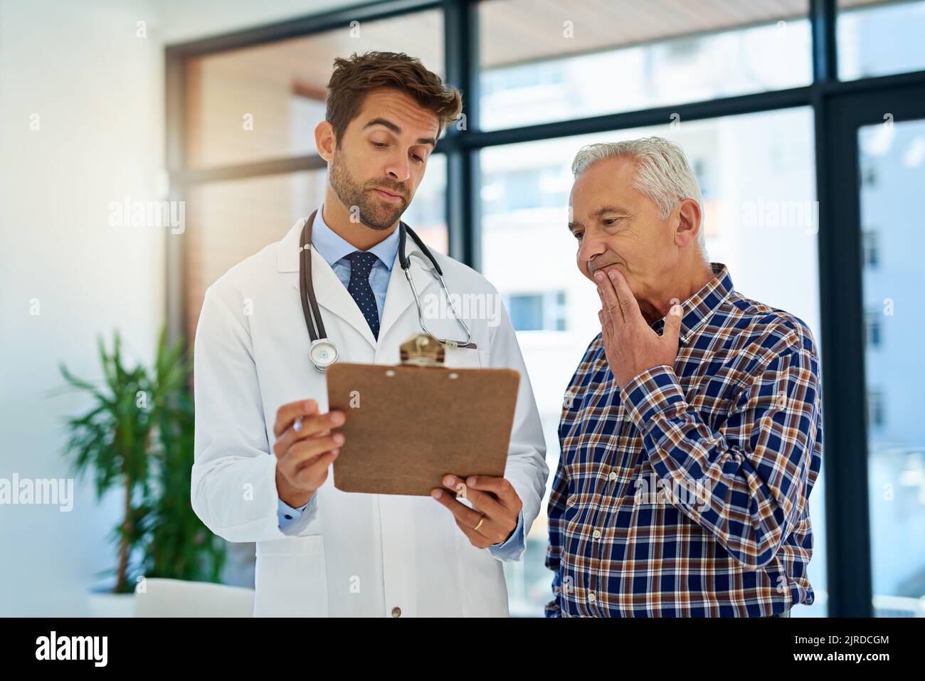 Im a little worried about your test results. a doctor and his mature ...