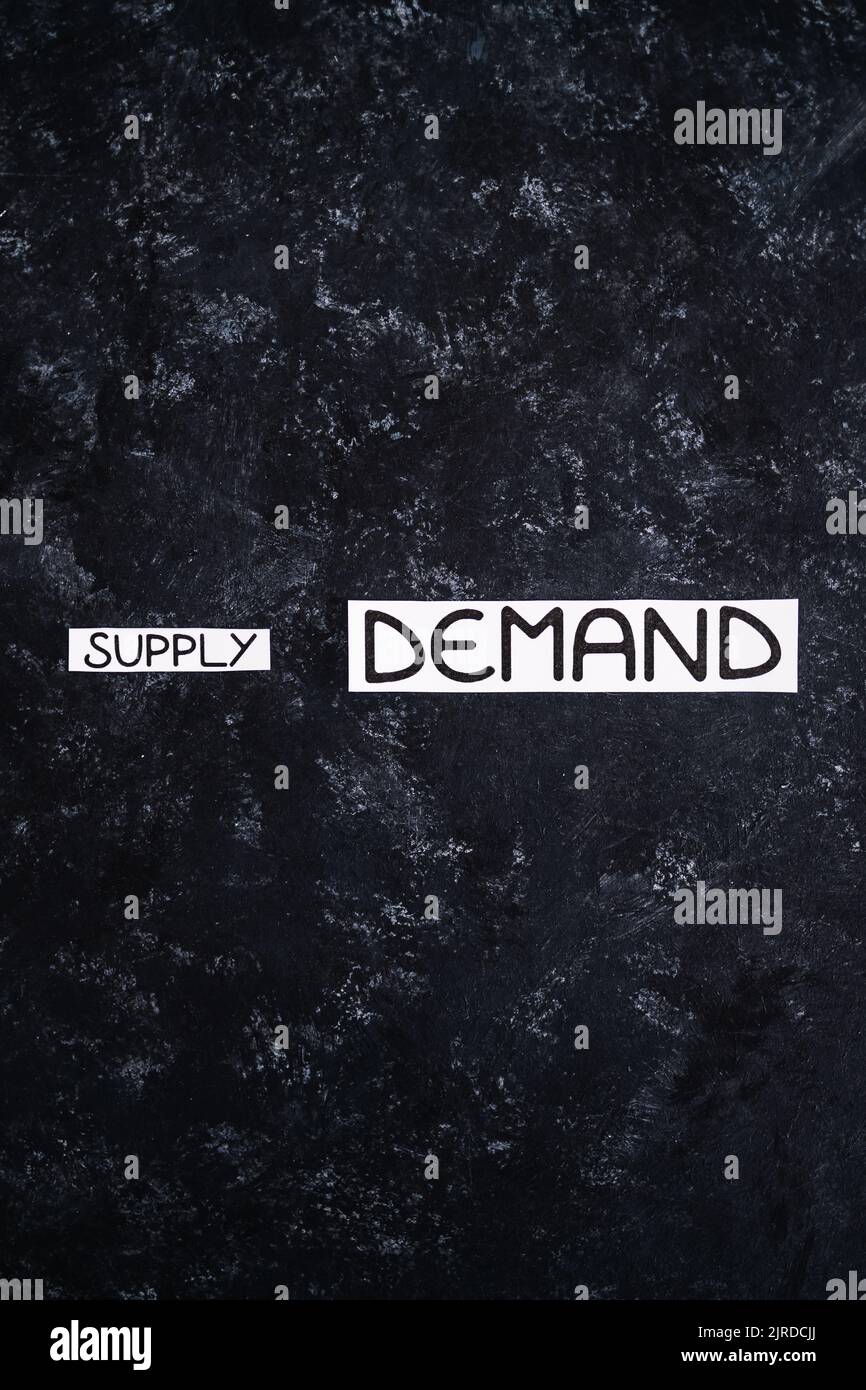 small Supply text and big Demand text on dark background, concept of ...