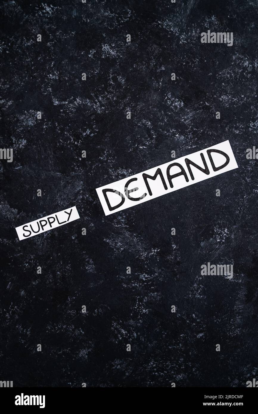 small Supply text and big Demand text on dark background, concept of ...