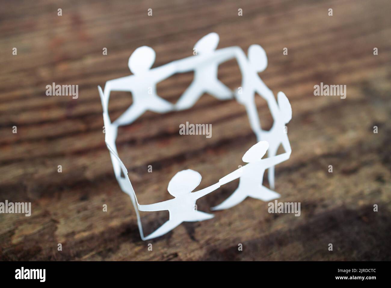 manpower and teamwork conceptual image, paper people chain creating a ...