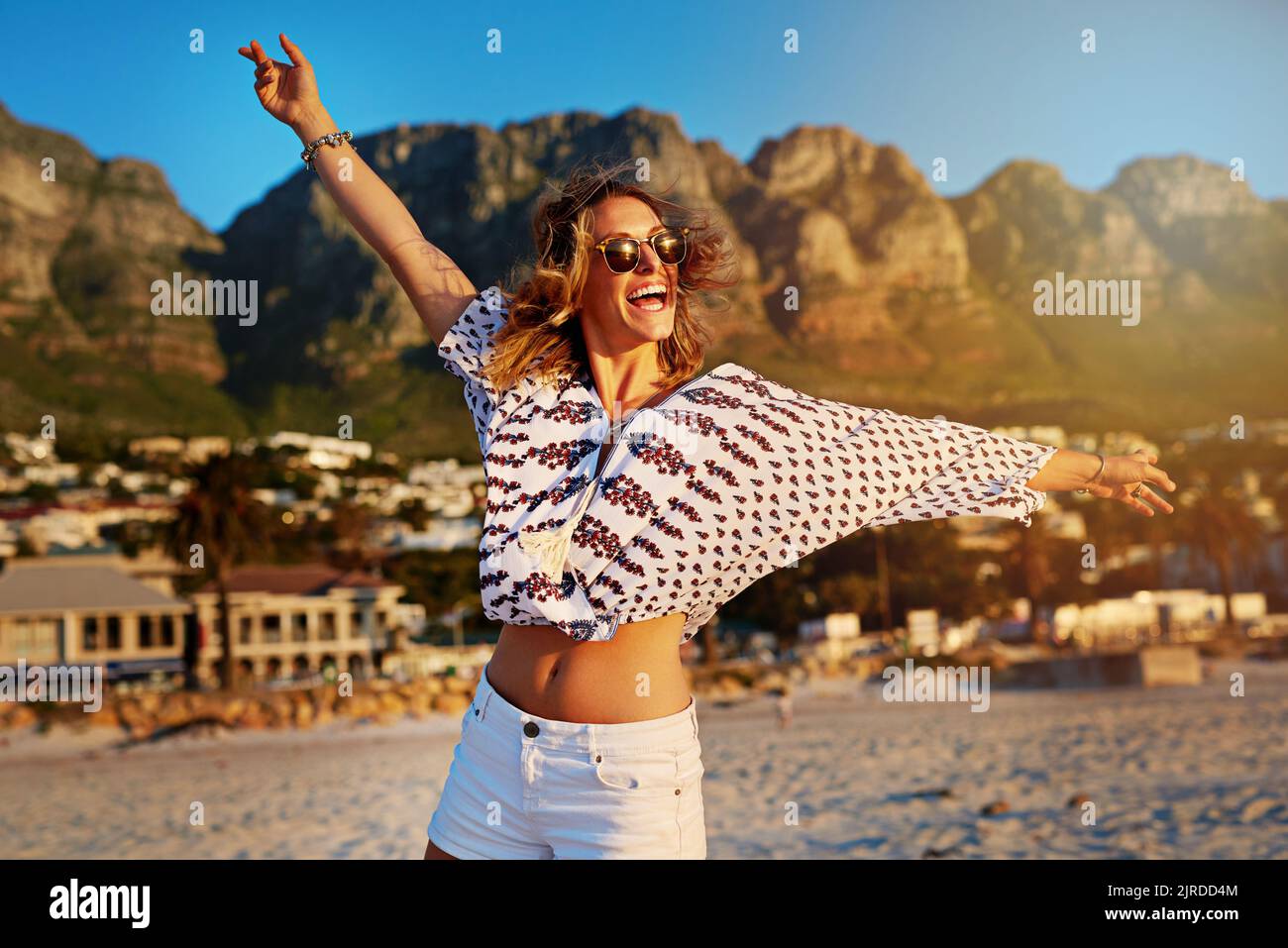 She feels most free at the beach. a young woman on the beach Stock ...
