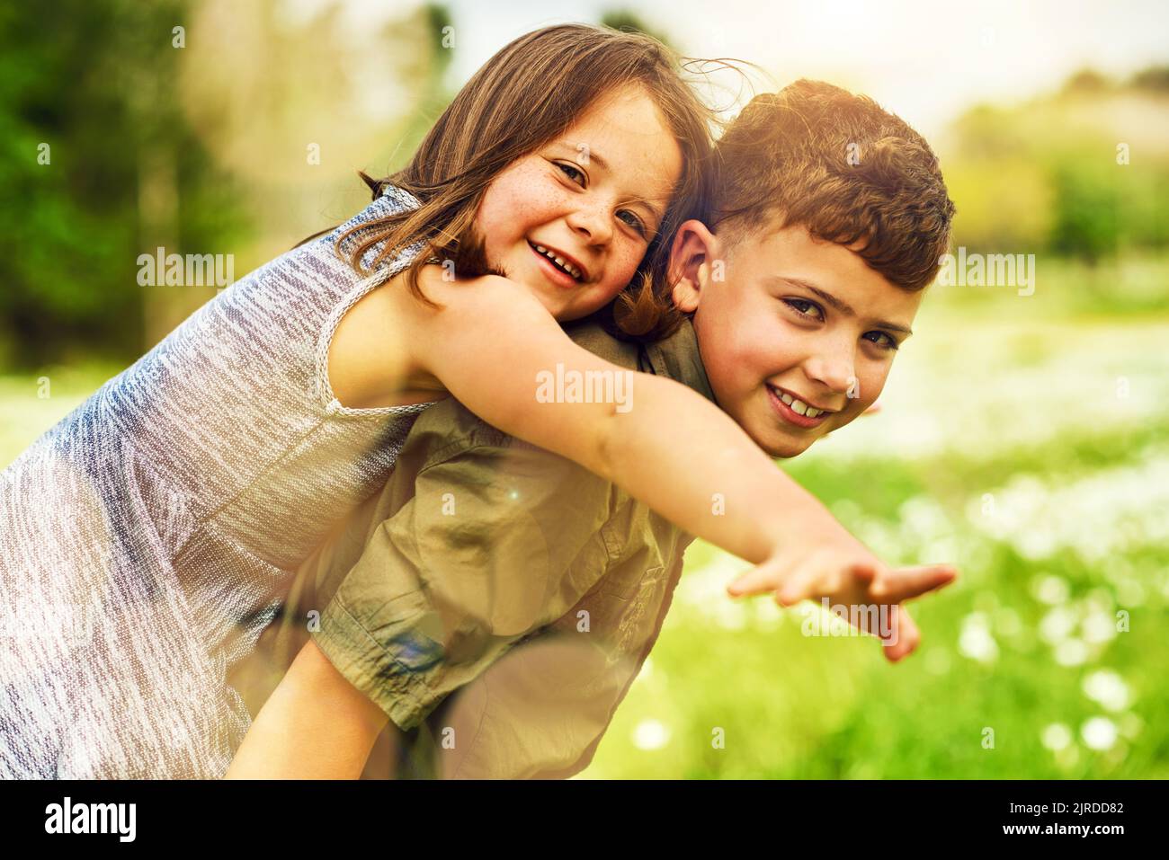 Sharing love and laughter. Portrait of an adorable little boy giving ...