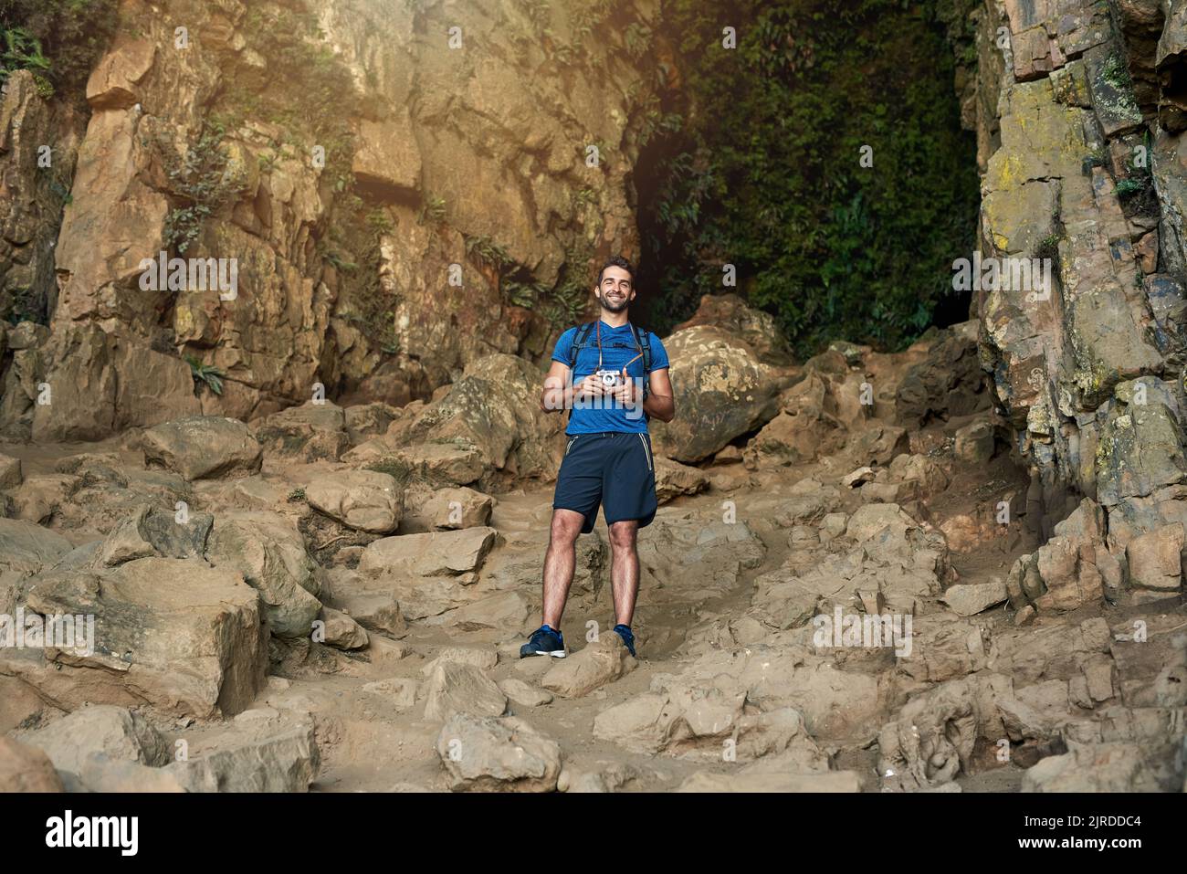 Its the perfect spot to capture some shots. a young man taking photos ...