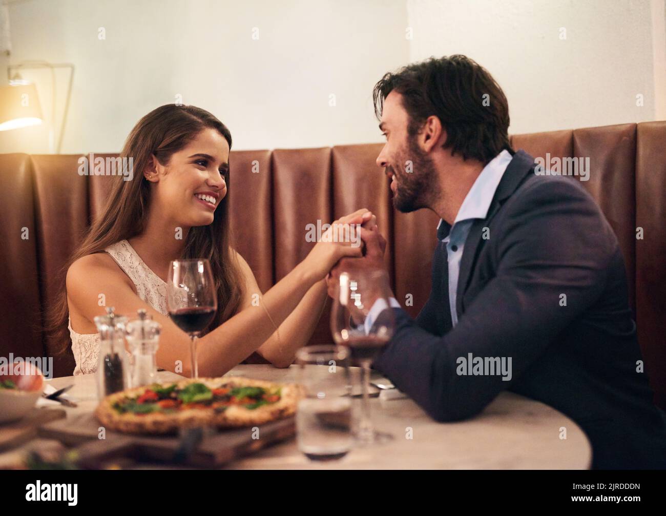 Couple kissing dinner table hi-res stock photography and images - Alamy