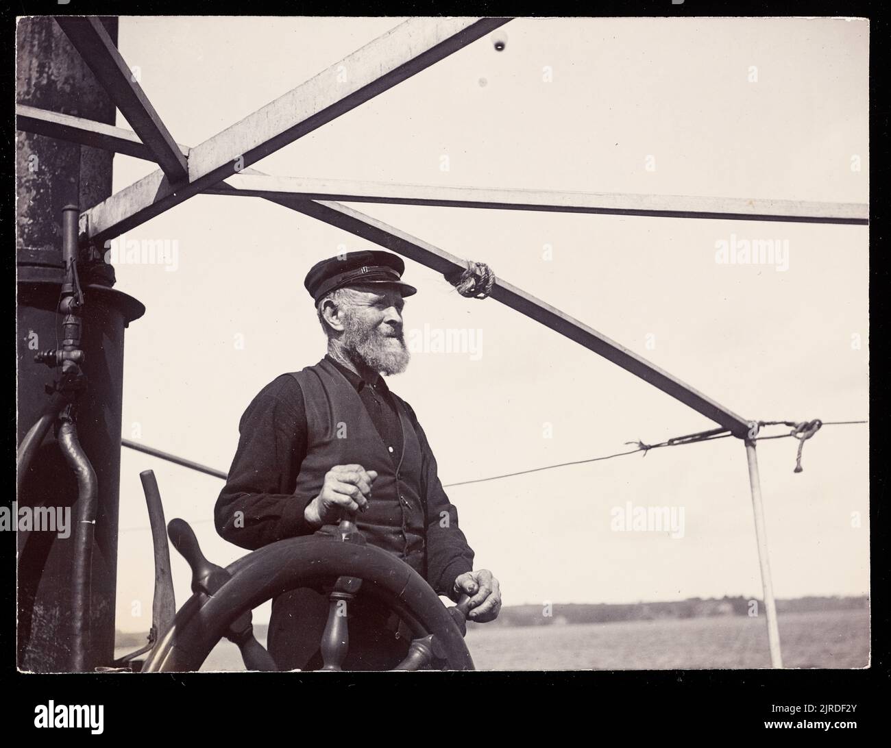 Captain sullivan at the helm captain sullivan at the helm hi-res stock ...