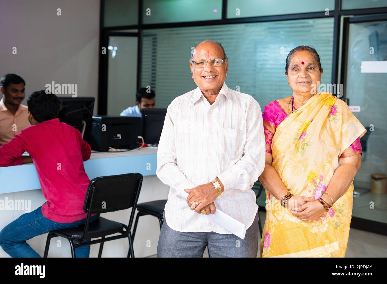 Portrait of Happy smiling senior couple standing by looking camera at ...