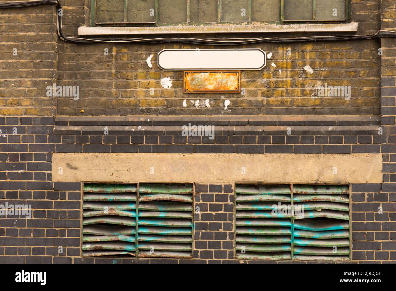 Close up of colorful different colored unkempt weathered old brick ...