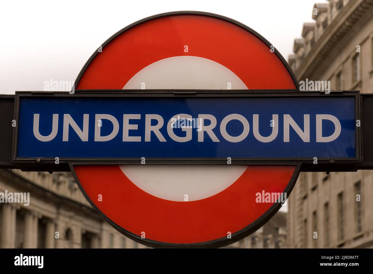 editorial close up of red blue underground metro subway sign in front ...