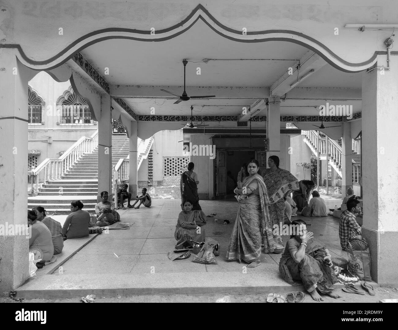 A group of people is taking a rest and performing prayers in a local ...