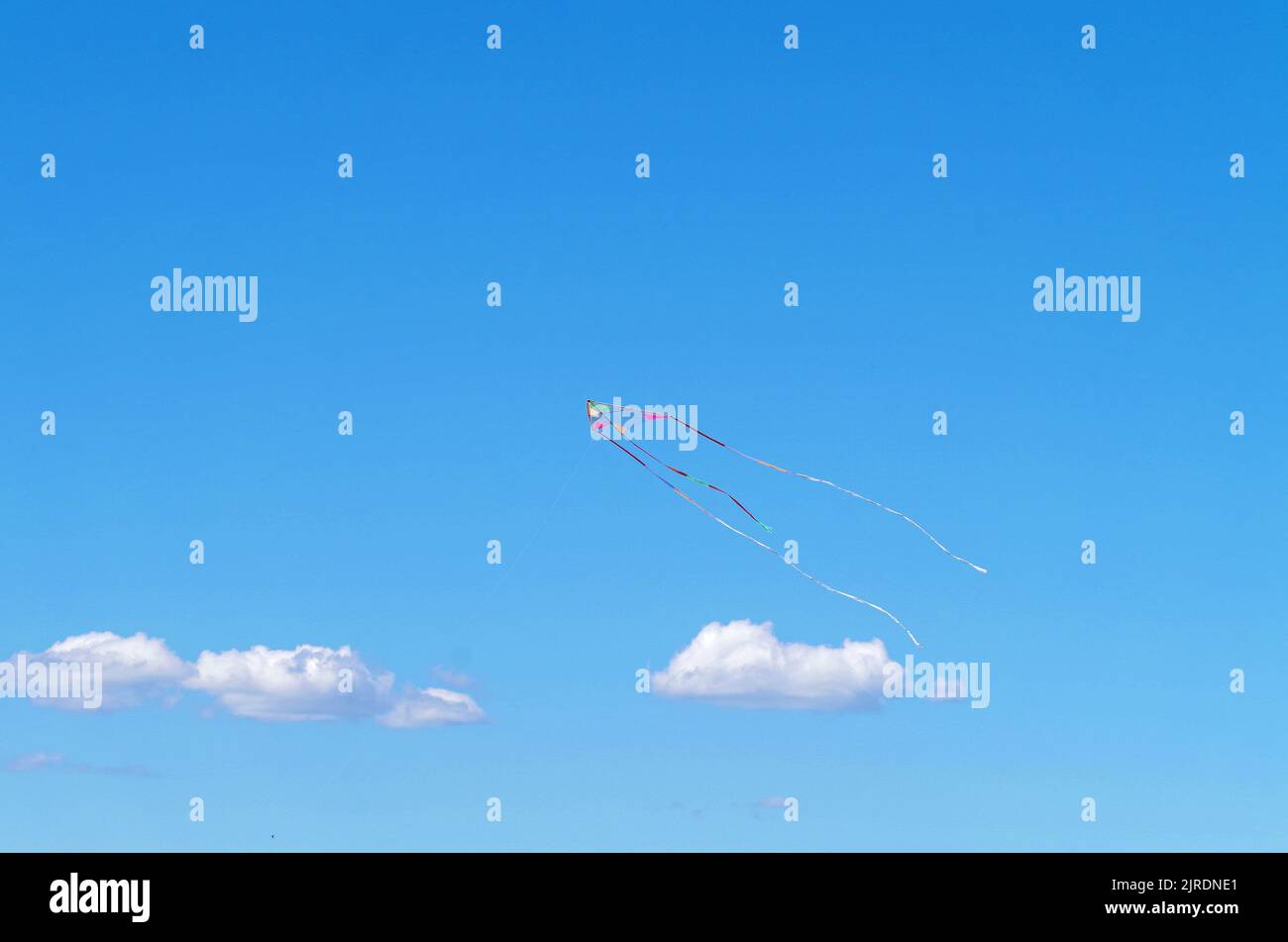 a simple single kite in the cloudy sky Stock Photo - Alamy