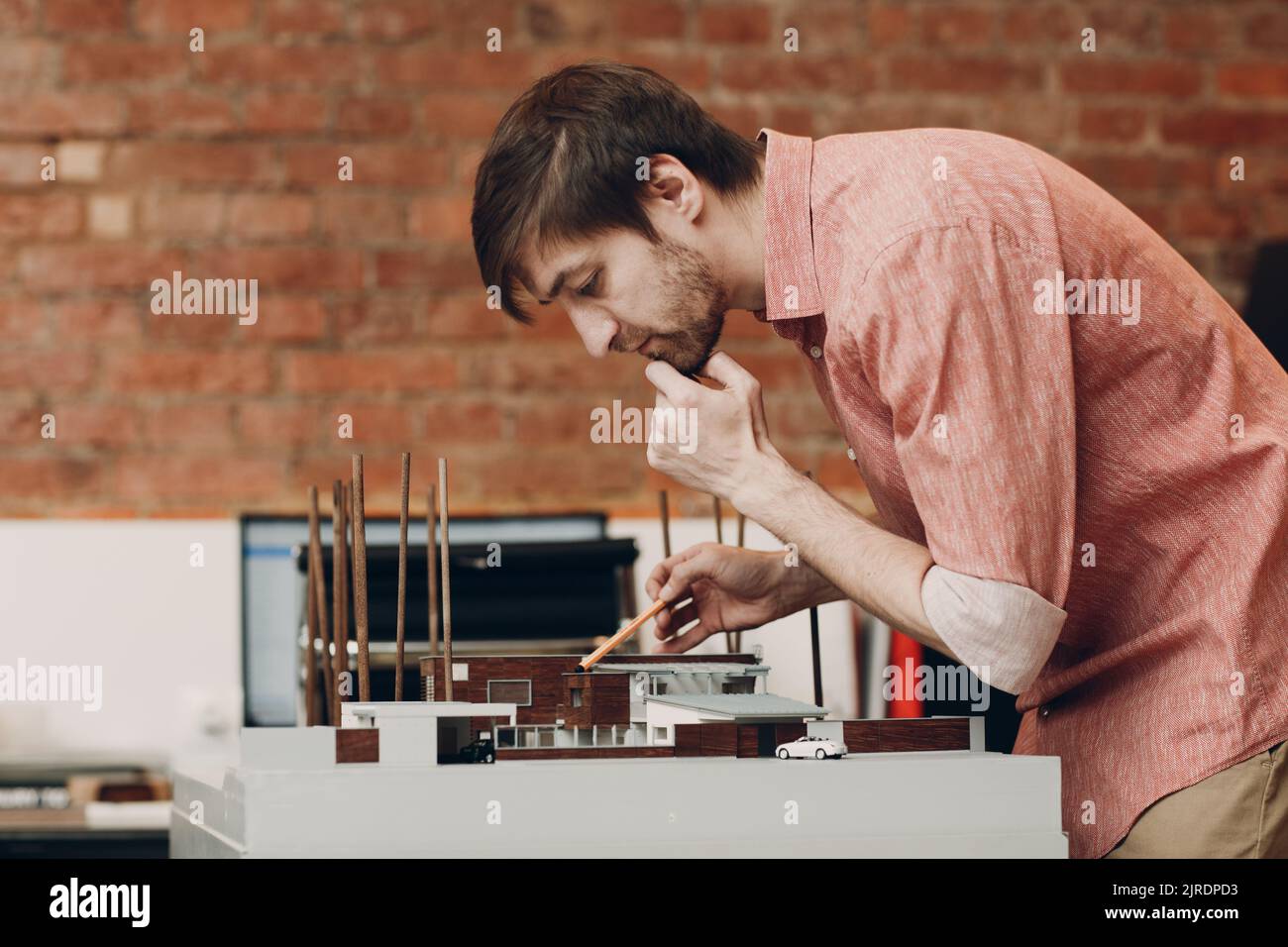 Architect with blueprints and layout design project at office bureau ...