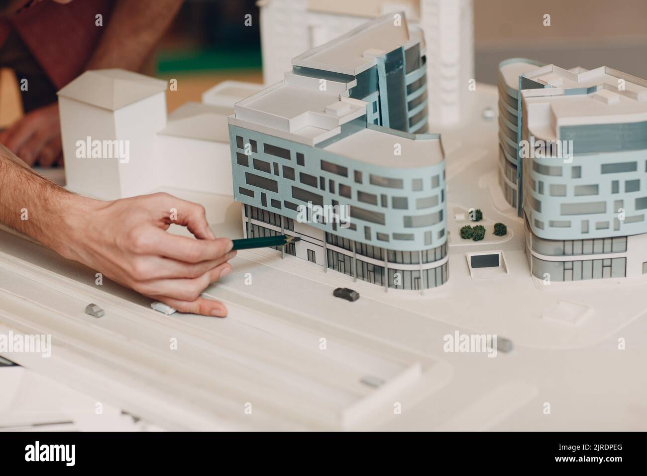 Architect with blueprints and layout design project at office bureau ...