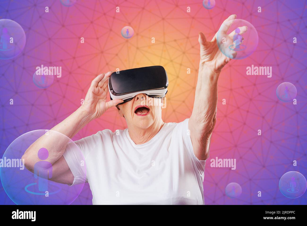 Metaverse and virtual reality. Amazement senior woman in VR glasses ...