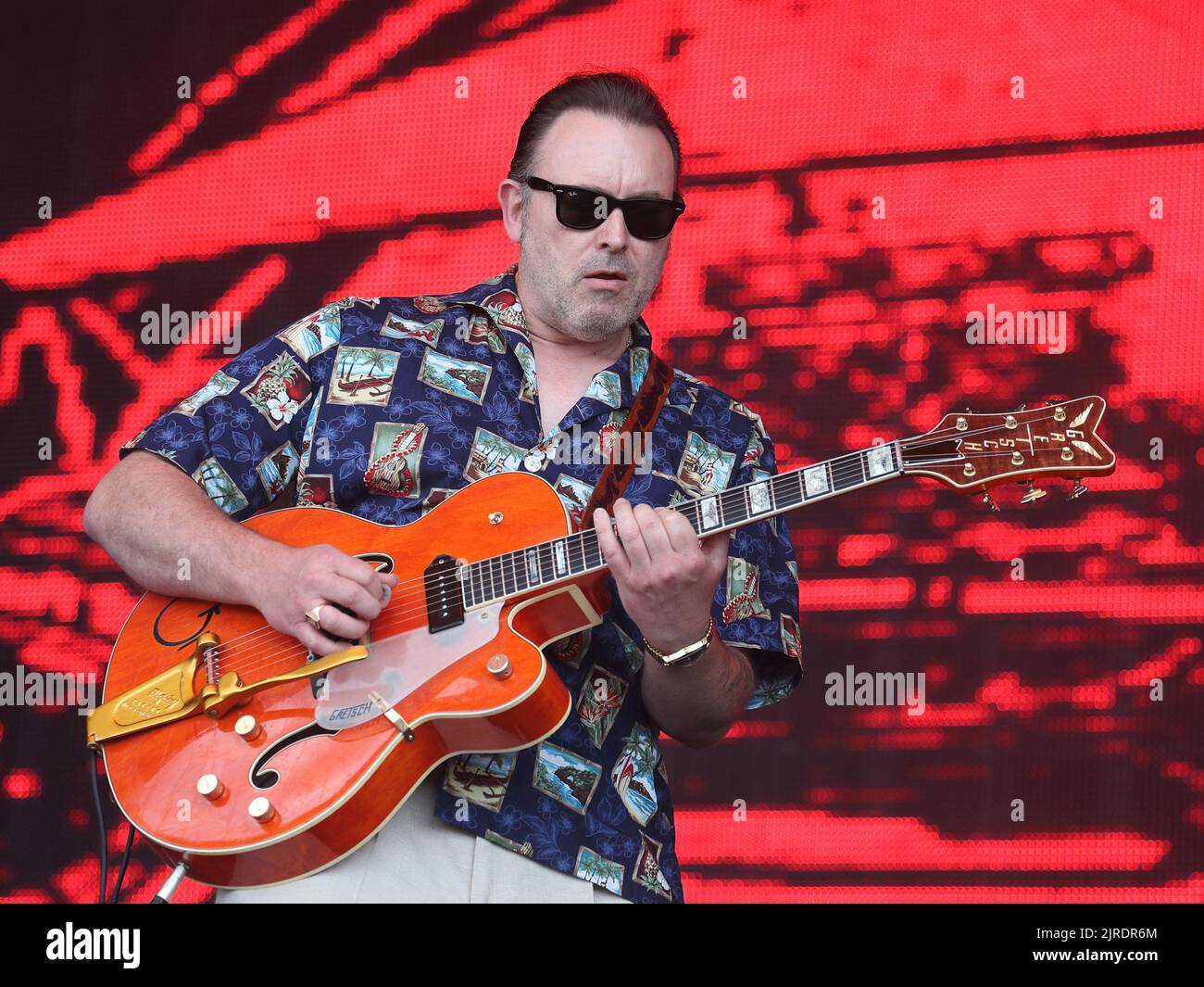 Slim Jim Phantom performing on stage at the 80s music Rewind Festival ...