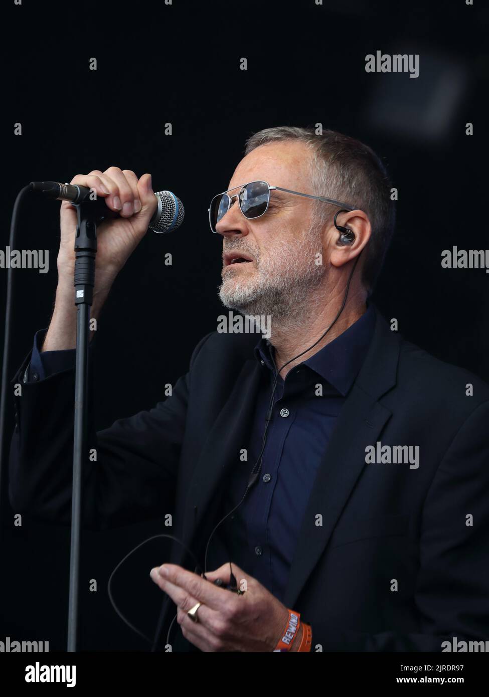Neil Arthur of Blancmange performing on stage at the 80s music Rewind ...