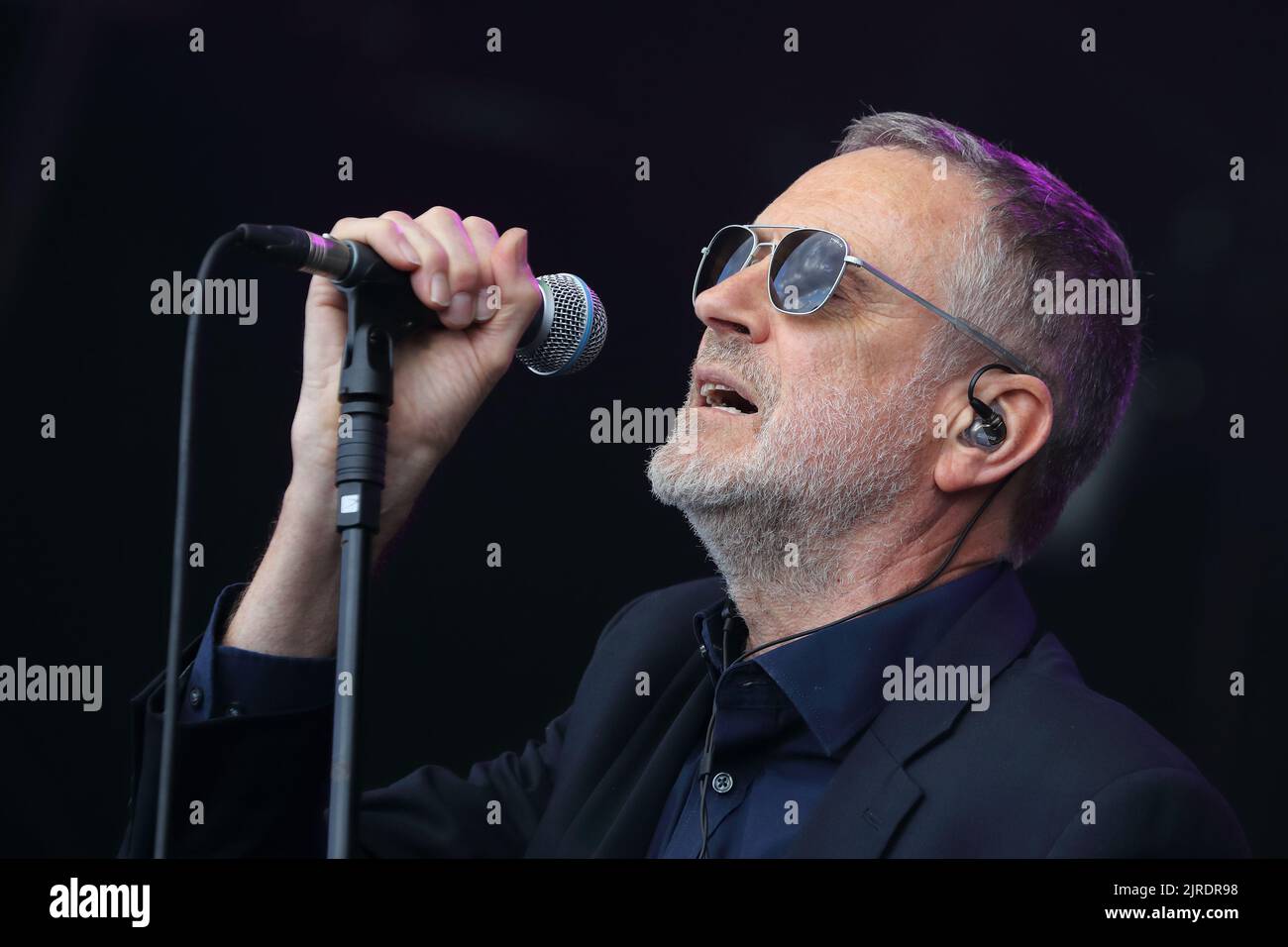 Neil Arthur of Blancmange performing on stage at the 80s music Rewind ...