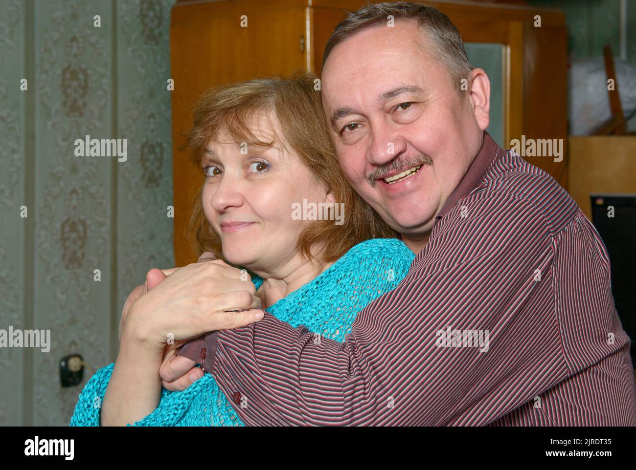 Closeup head and shoulders portrait of elderly pair that are friendly ...