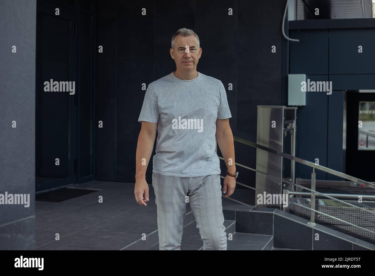 Man standing on stairs hi-res stock photography and images - Alamy