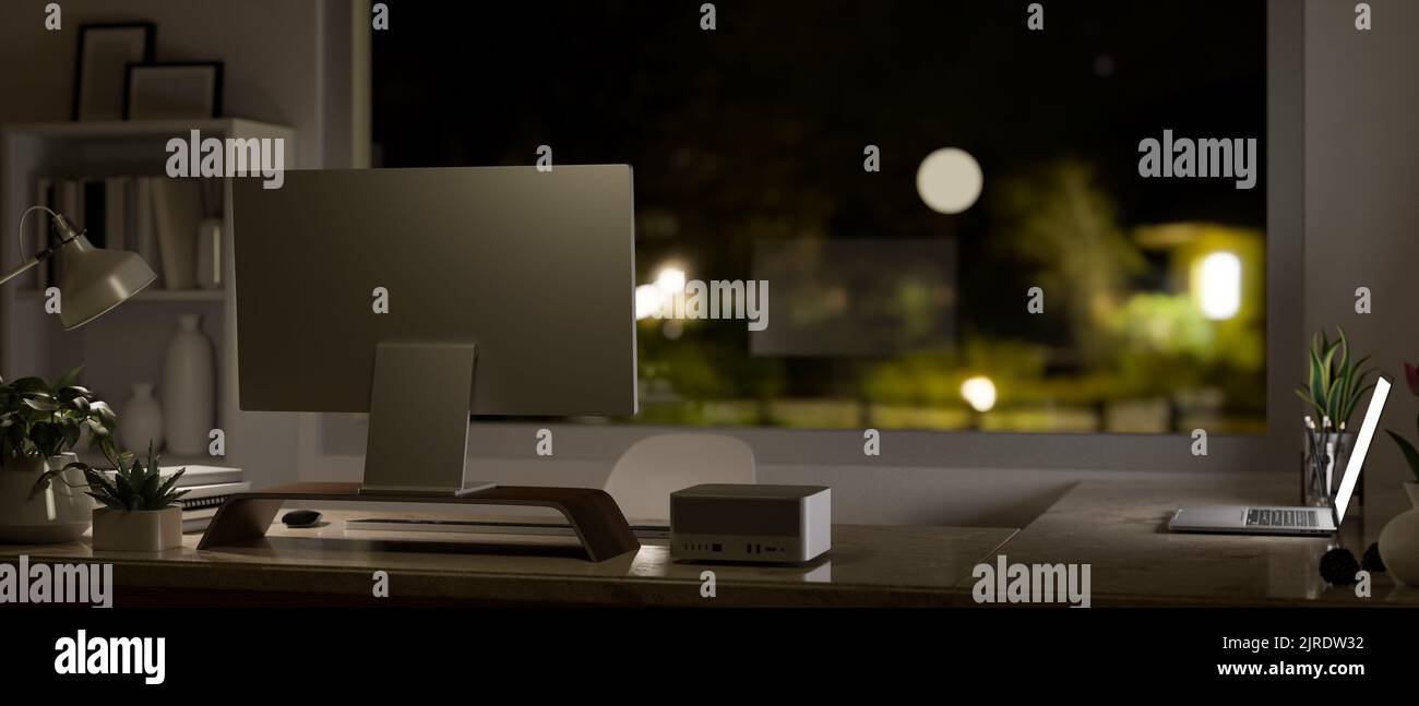 Modern office desk in the darkness room at night with pc computer ...