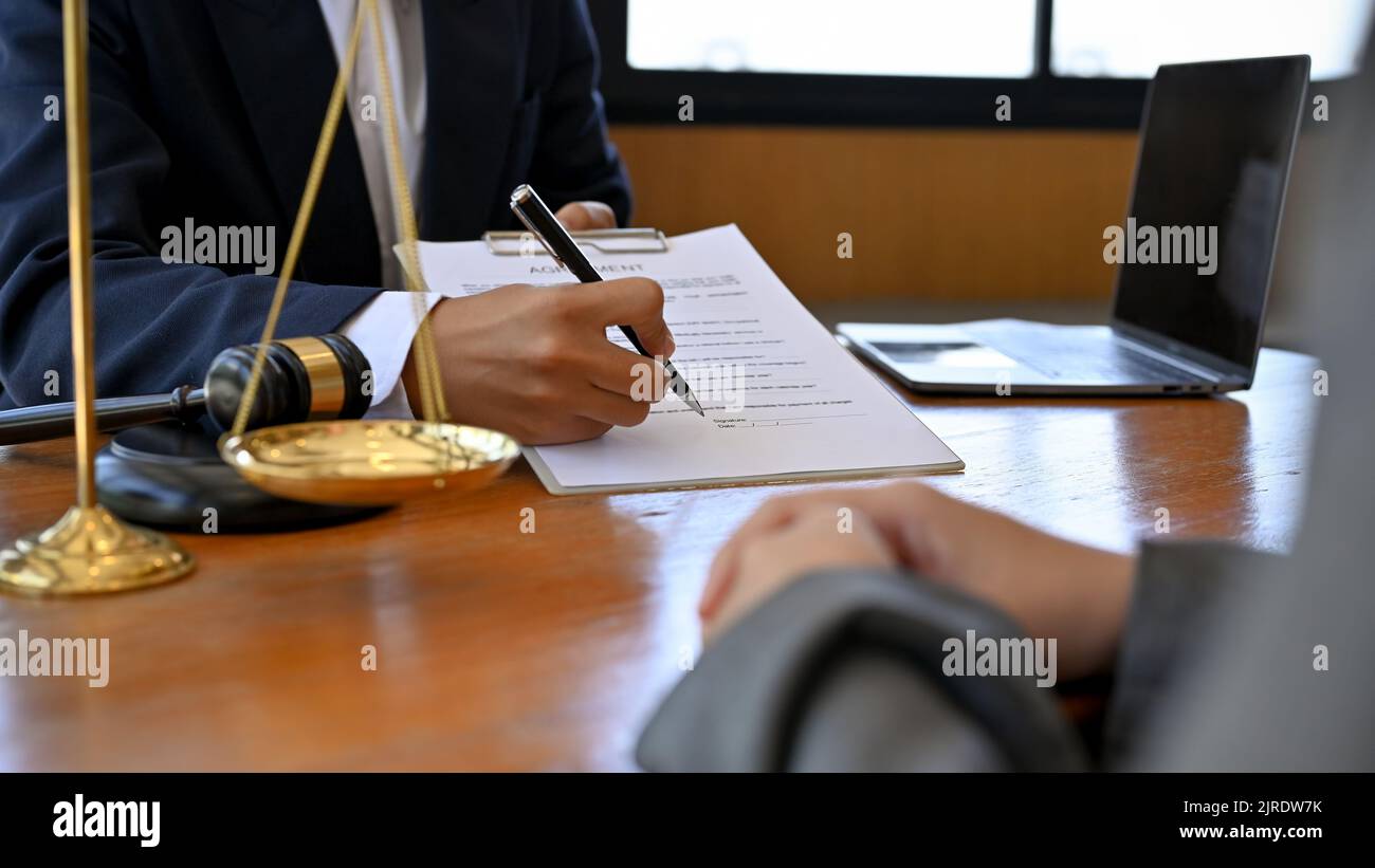 A professional male lawyer in the meeting, explaining the agreement on ...
