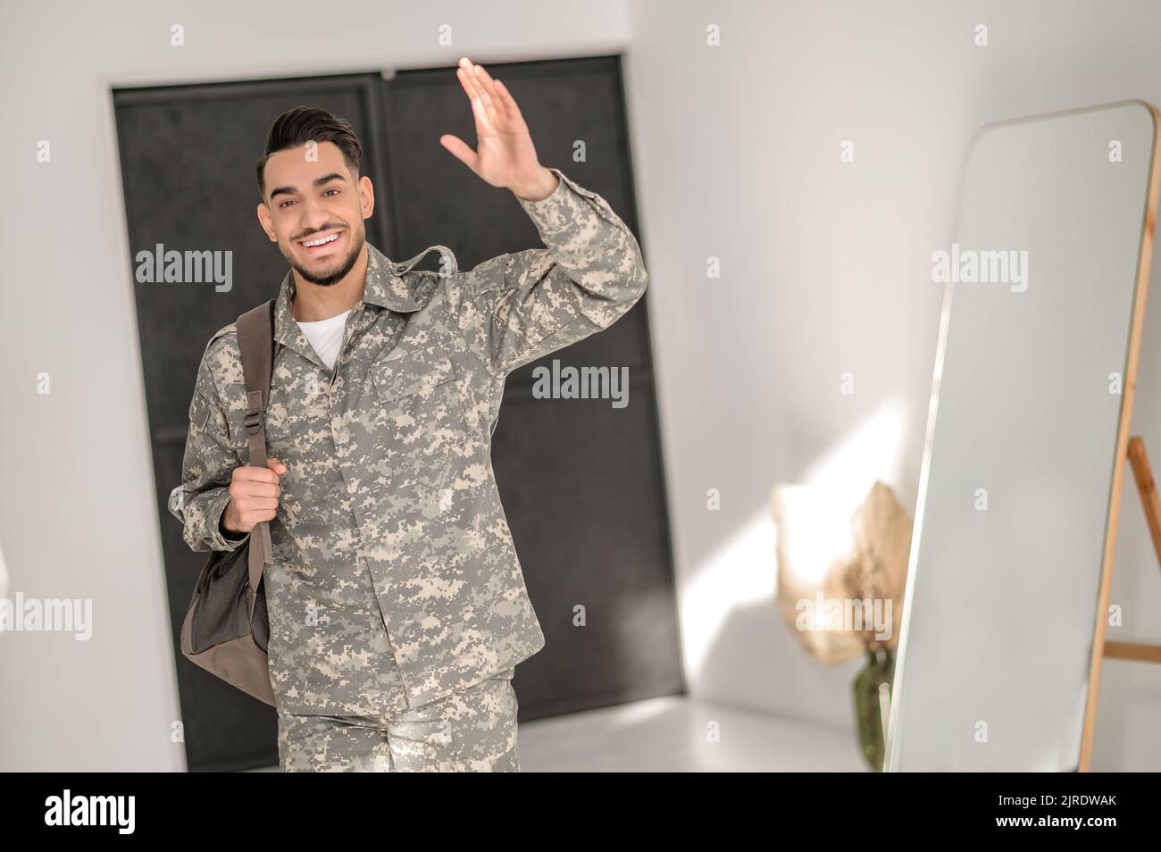 Joyful young soldier coming back from the war Stock Photo - Alamy