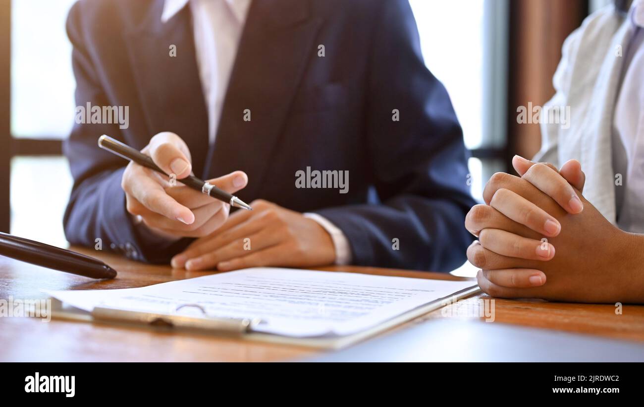 A professional male real estate agent or business consultant is meeting, talking, and giving ...