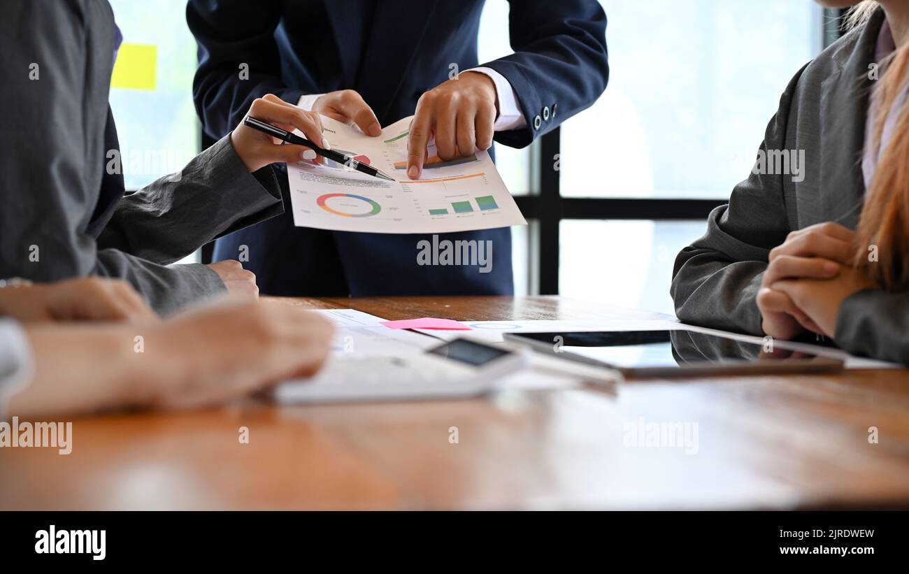 Professional male boss lead the financial meeting, explaining and ...