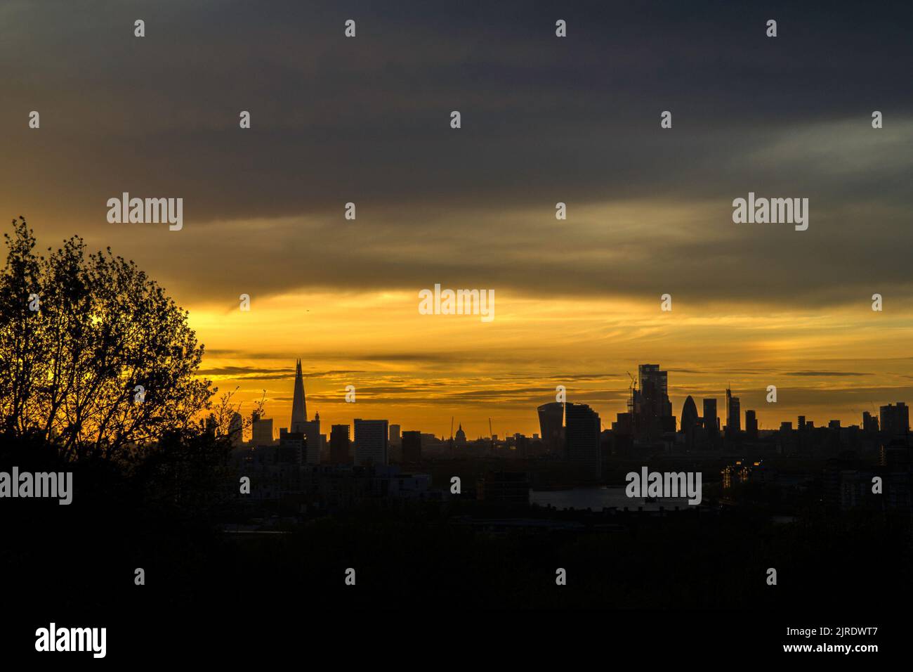 A dramatic sunset over Central London as seen from Greenwich Stock ...